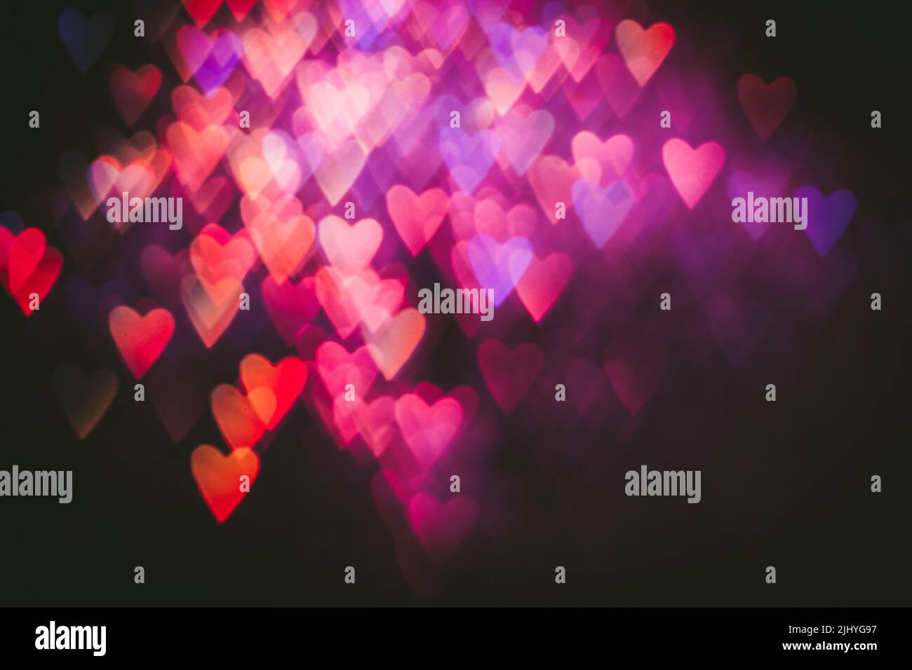 Abstract background of colorful hearts in motion Stock Photo - Alamy