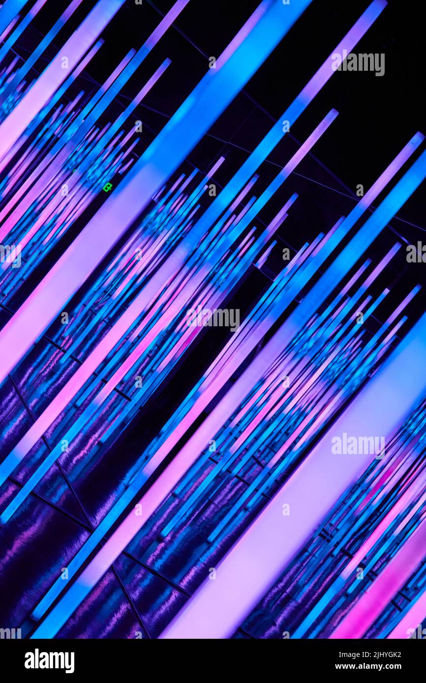 Abstract angled light poles in pink and blue Stock Photo - Alamy