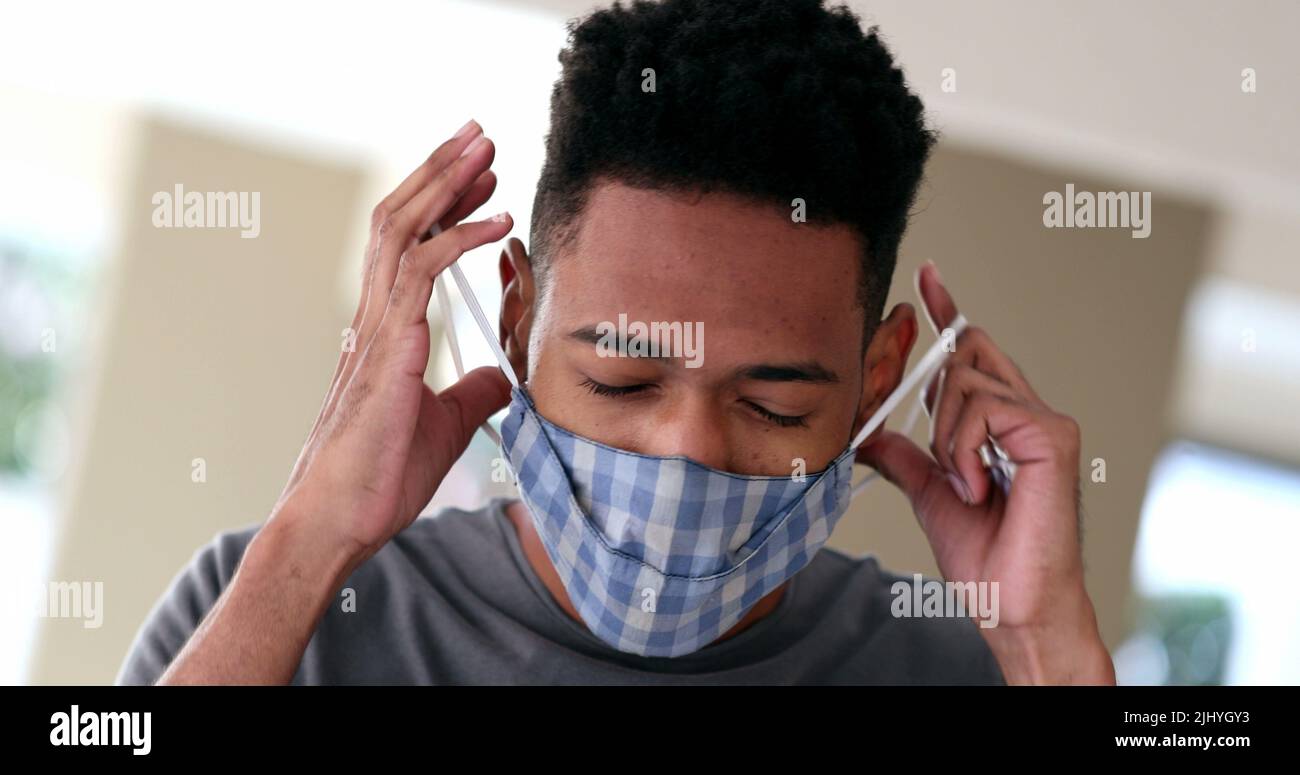 African man removing mask prevention hi-res stock photography and ...