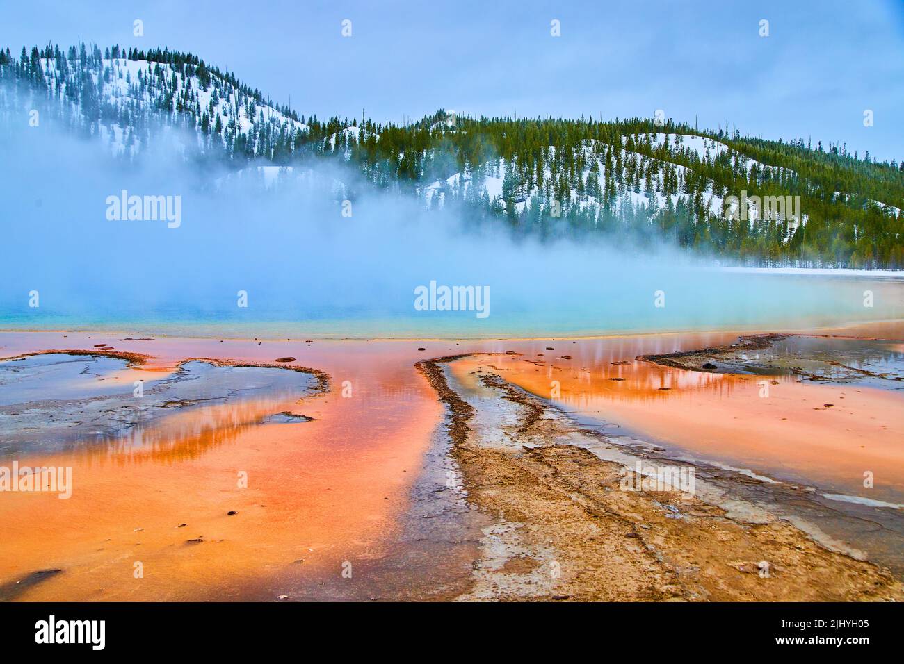 Winter with huge cloud of sulfur steam covering iconic Yellowstone ...