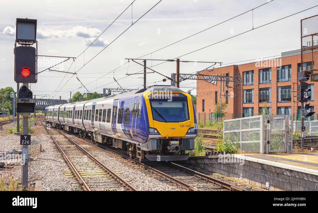 A train departs from a railway station. There is a traffic signal in ...