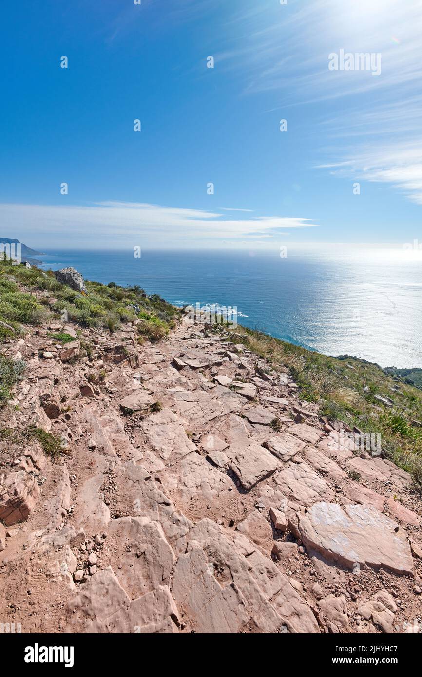 Mountain trail to beautiful big ocean blue sky. Adventure through ...