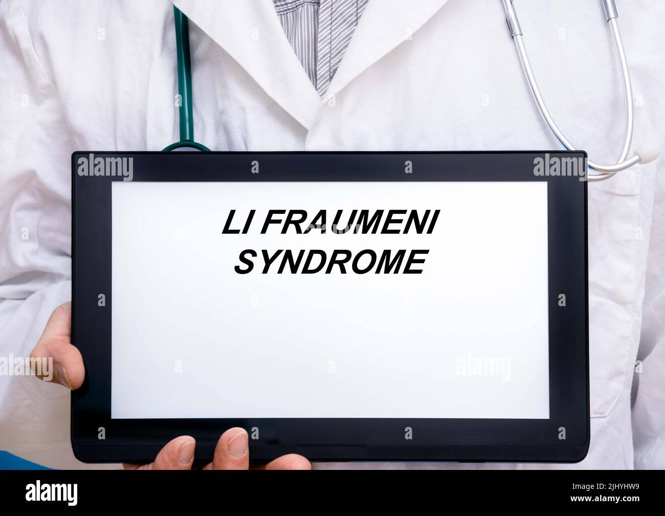Li Fraumeni Syndrome. Doctor with rare or orphan disease text on tablet ...