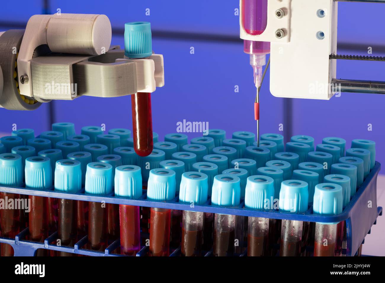 modern genetic laboratory PCR processor and robot with test tube in ...