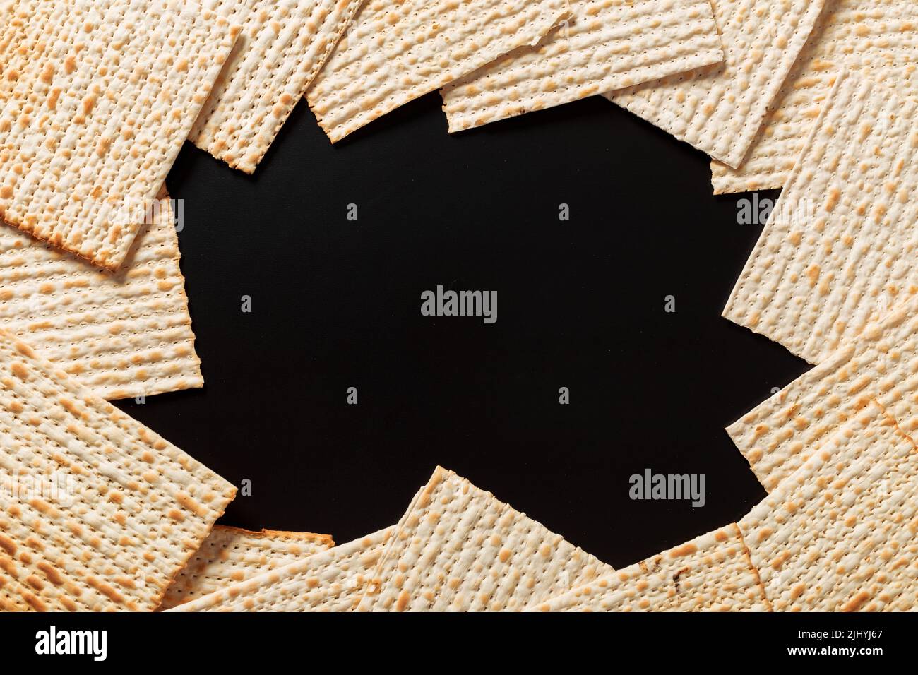 A photo of matzah or matza pieces on black background. Matzah for the ...