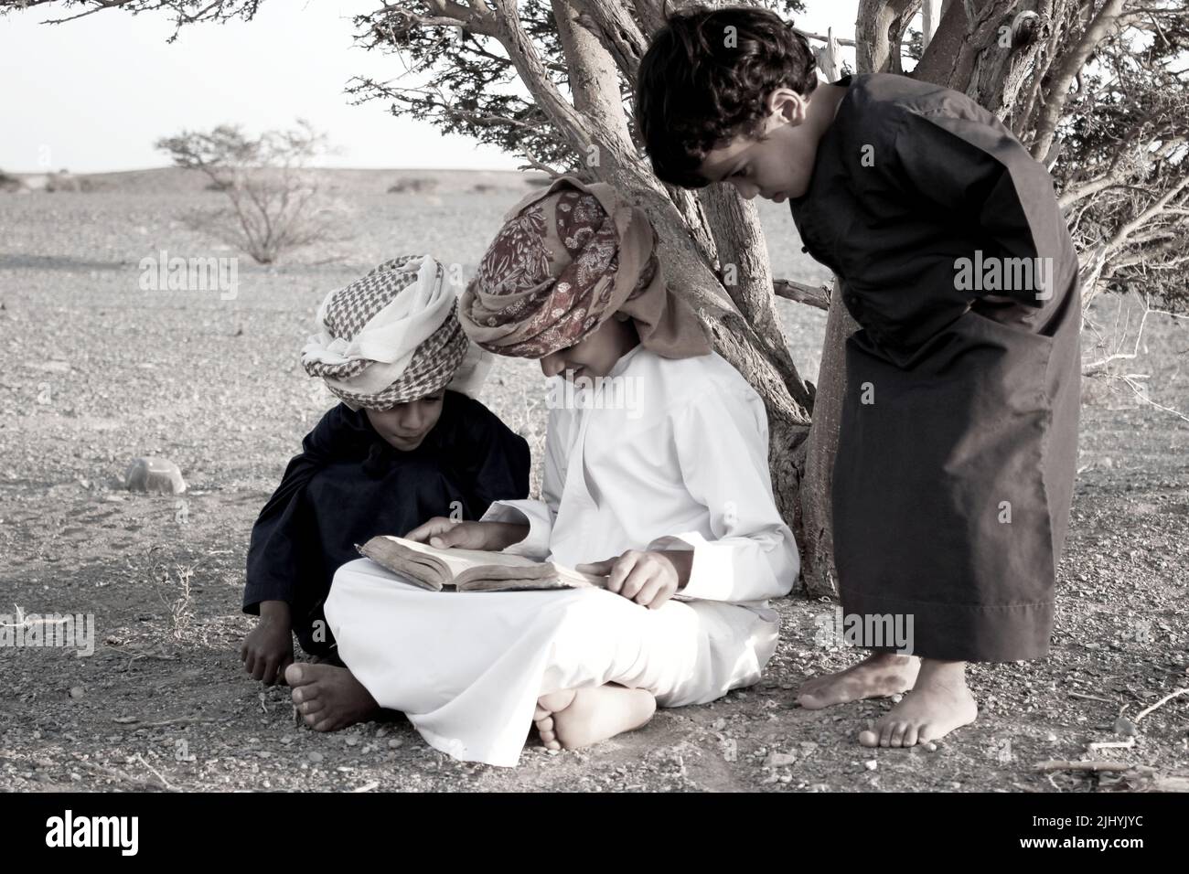 Omani boys reading Stock Photo - Alamy