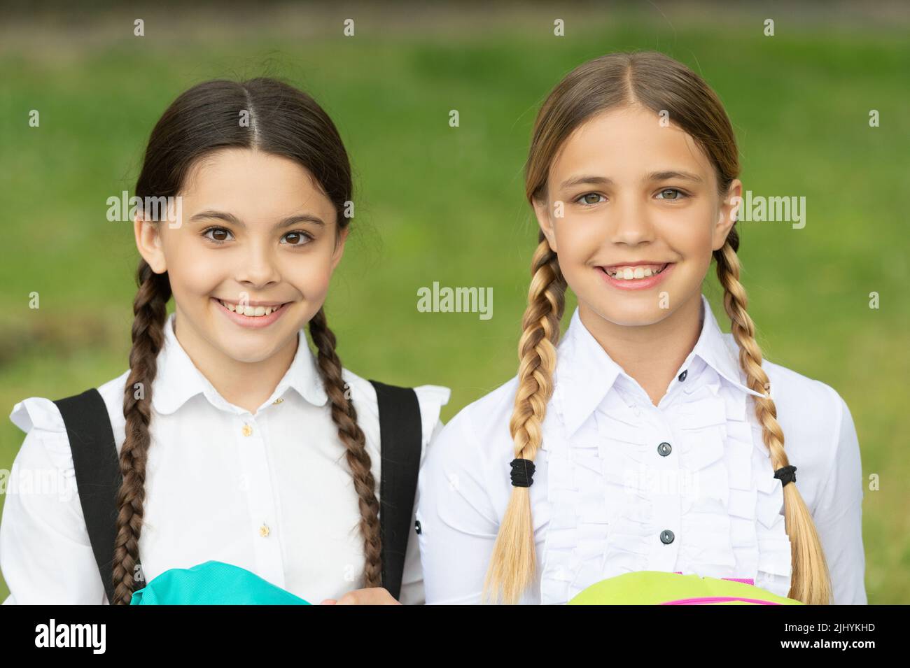 schoolgirl portrait. two smiling teen children schoolgirls outdoor ...