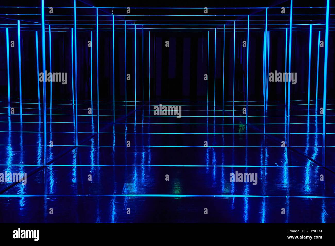 Mirror walkway lined with blue neon lights Stock Photo - Alamy
