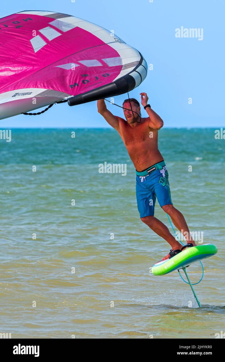 Wing foiling / wing surfing on the North Sea showing wingboarder / wing ...