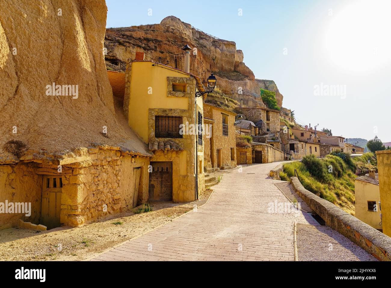 Old houses dug into the rock of the mountain in the medieval village of ...