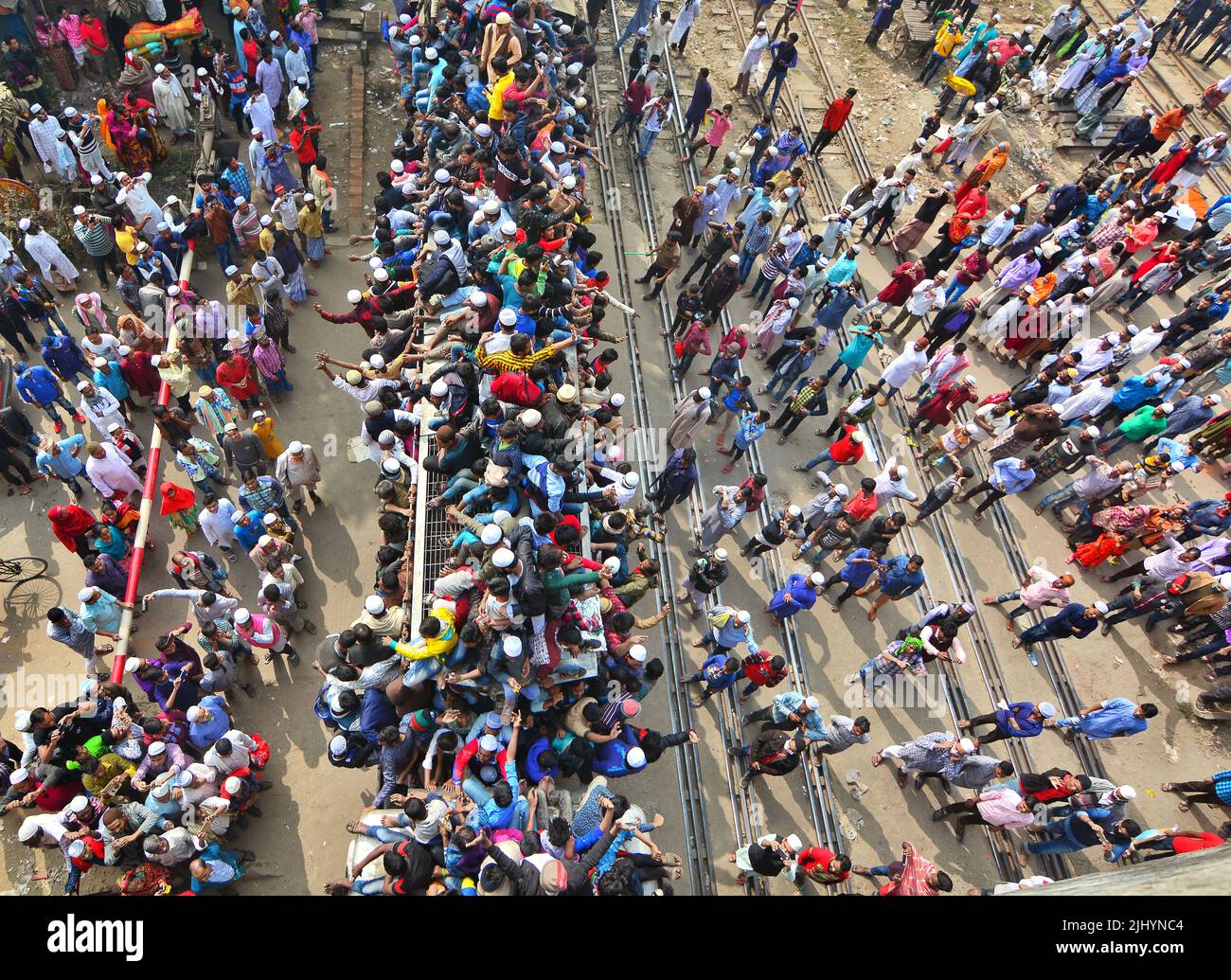 Thousands ride on train roofs during Ijtema in Bangladesh, showing massive human movement ...