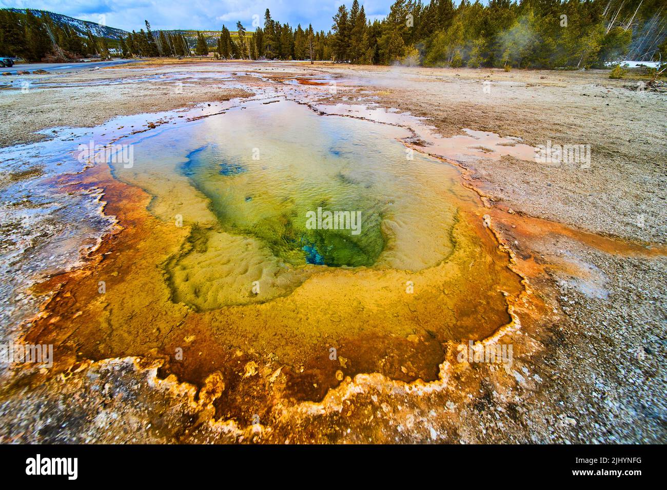 Yellowstone hot spring with warm and cool colors Stock Photo - Alamy