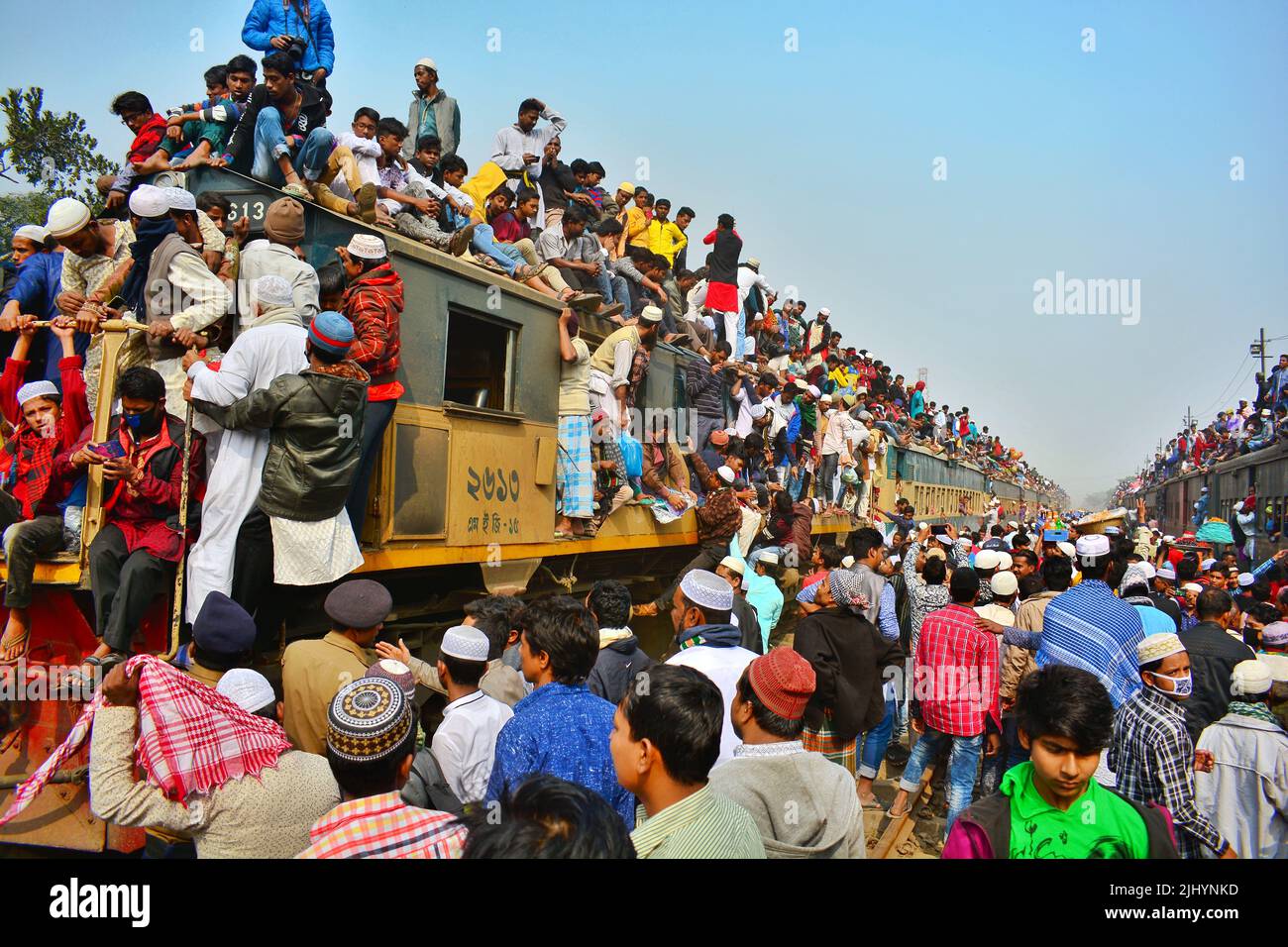 Thousands ride on train roofs during Ijtema in Bangladesh, showing ...