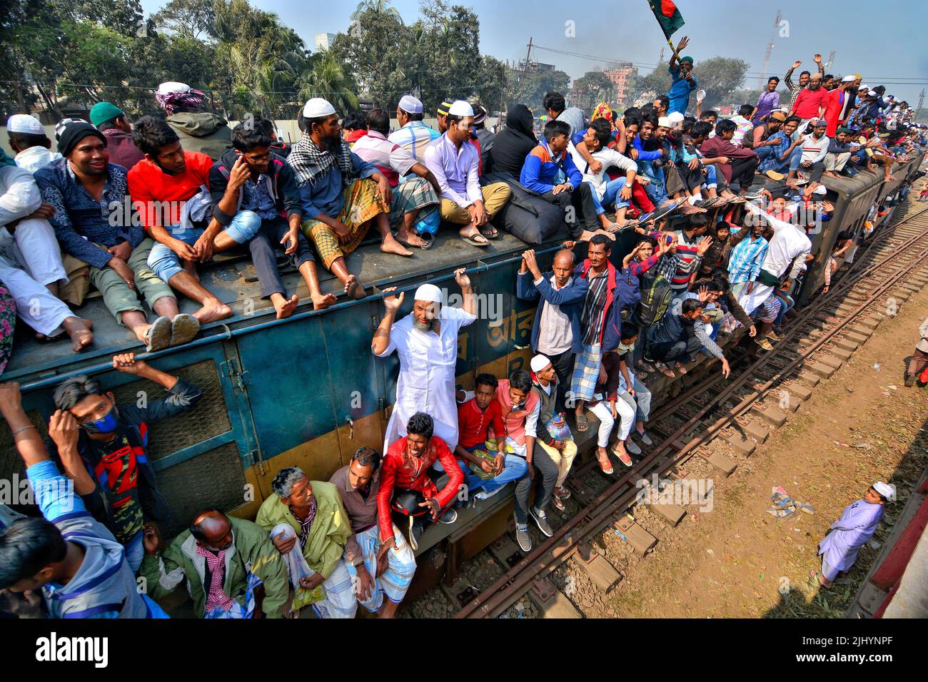 Thousands ride on train roofs during Ijtema in Bangladesh, showing ...