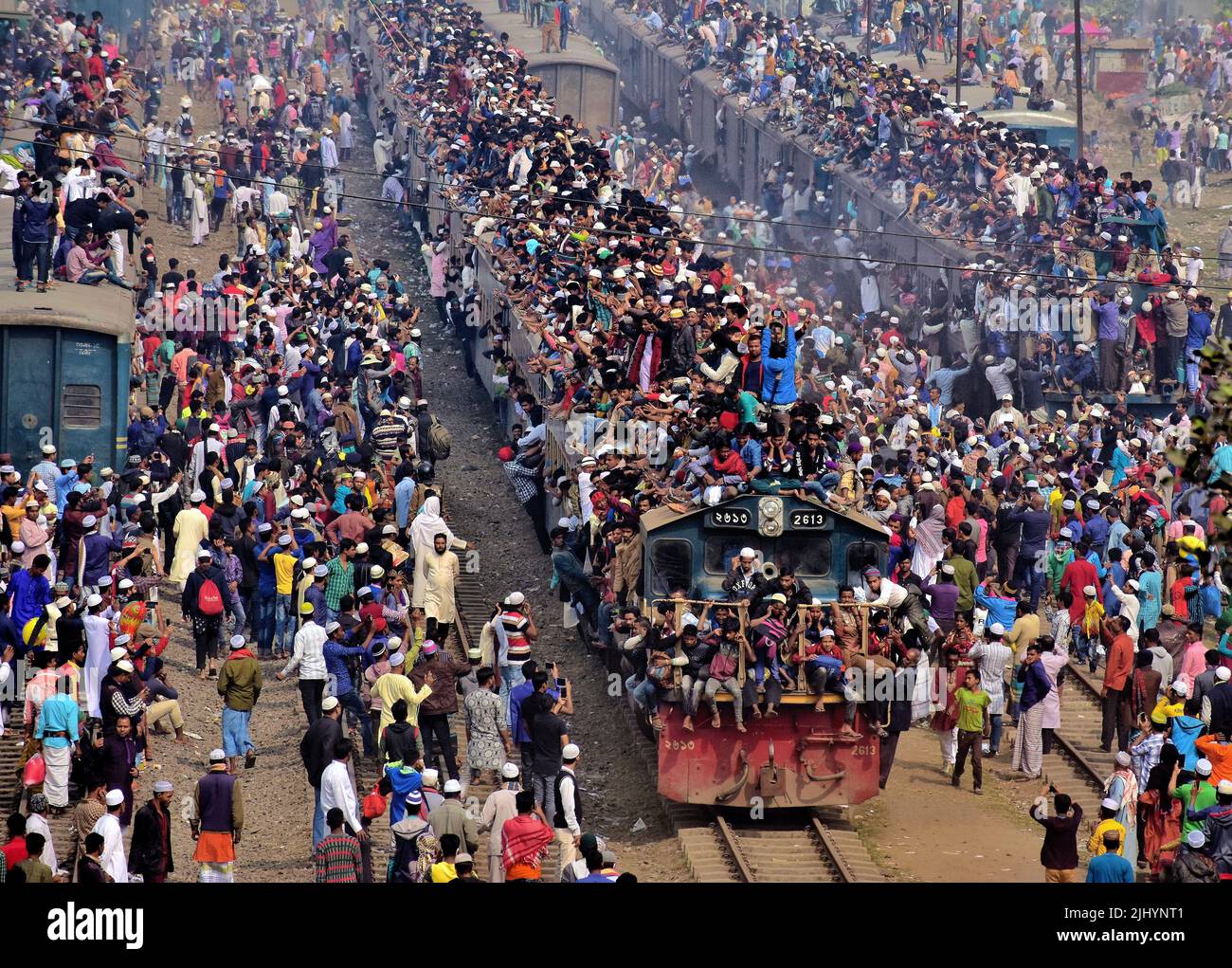 Thousands ride on train roofs during Ijtema in Bangladesh, showing ...