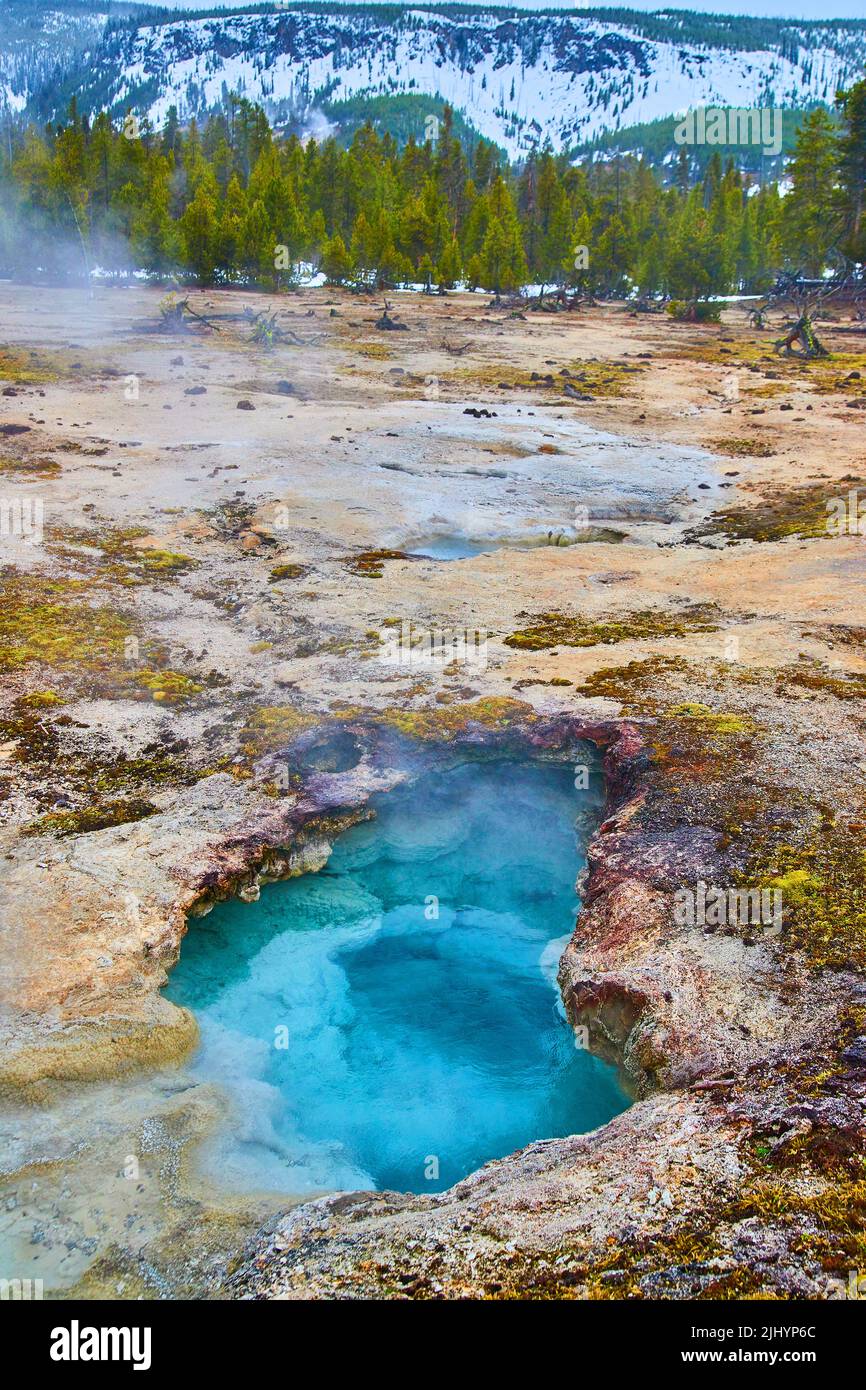 Yellowstone in winter with deep blue thermal pools Stock Photo - Alamy
