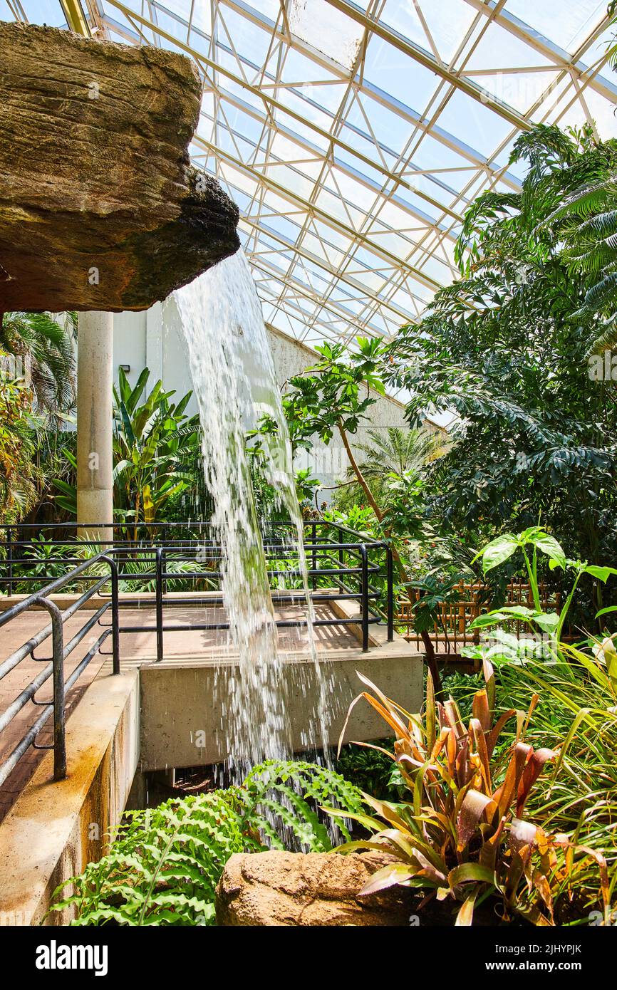 Waterfall inside rain forest greenhouse with glass ceiling Stock Photo ...