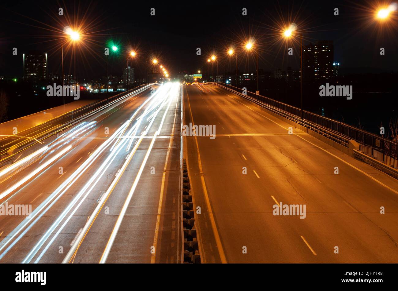 A long exposure shot of street lights at night Stock Photo - Alamy