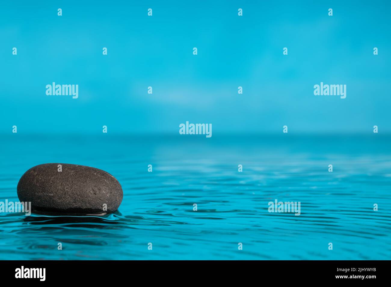 Zen background blue color with Japanese stones for spa, meditation and ...