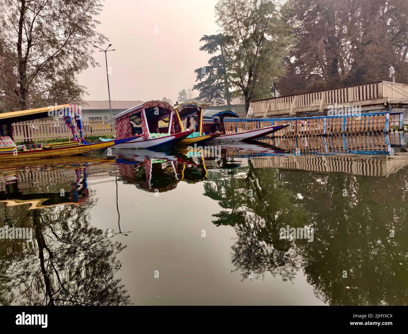 Traditional Indian boats parked in a lake Stock Photo - Alamy