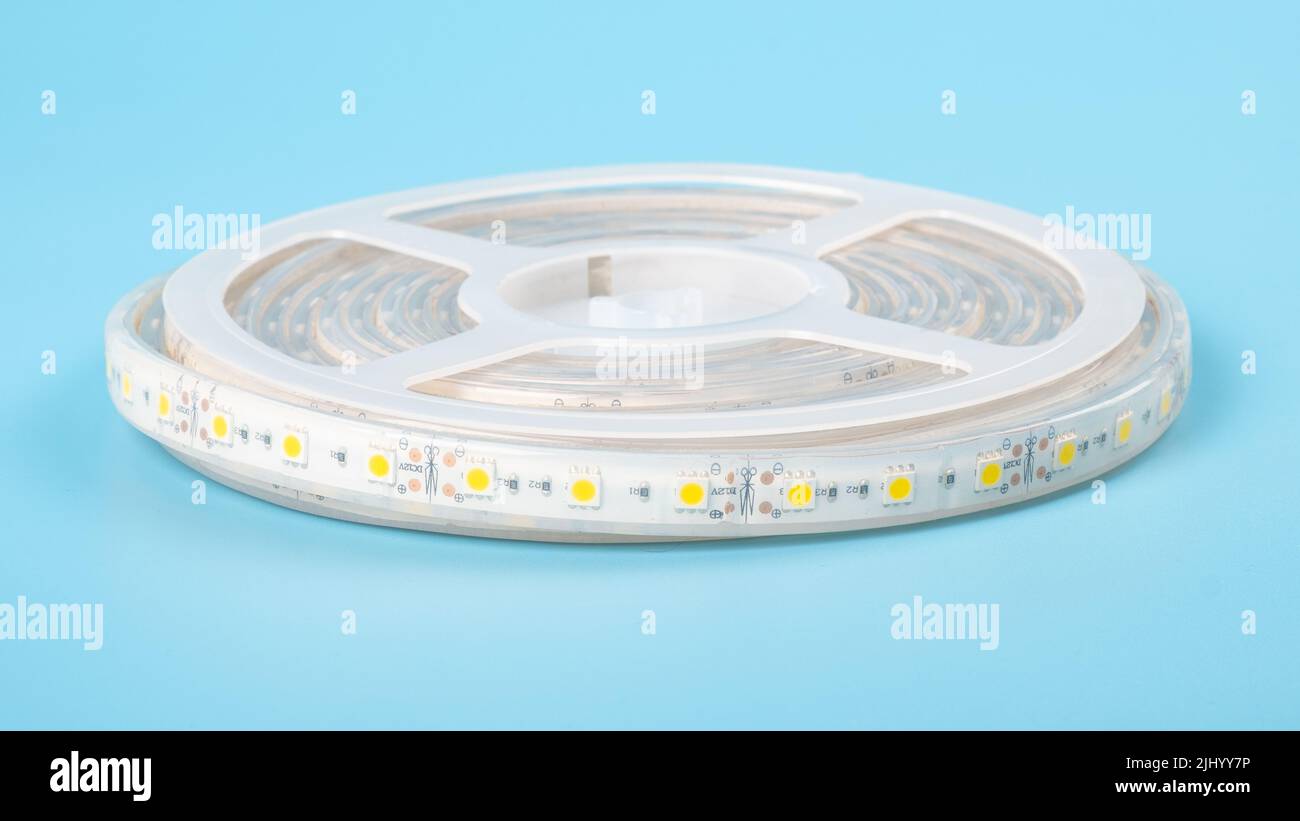 led strip on blue background, coil of diode light Stock Photo - Alamy