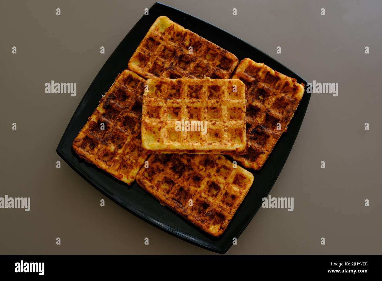 Sweet waffles prepared for serving. A tasty dessert eaten with fruit ...