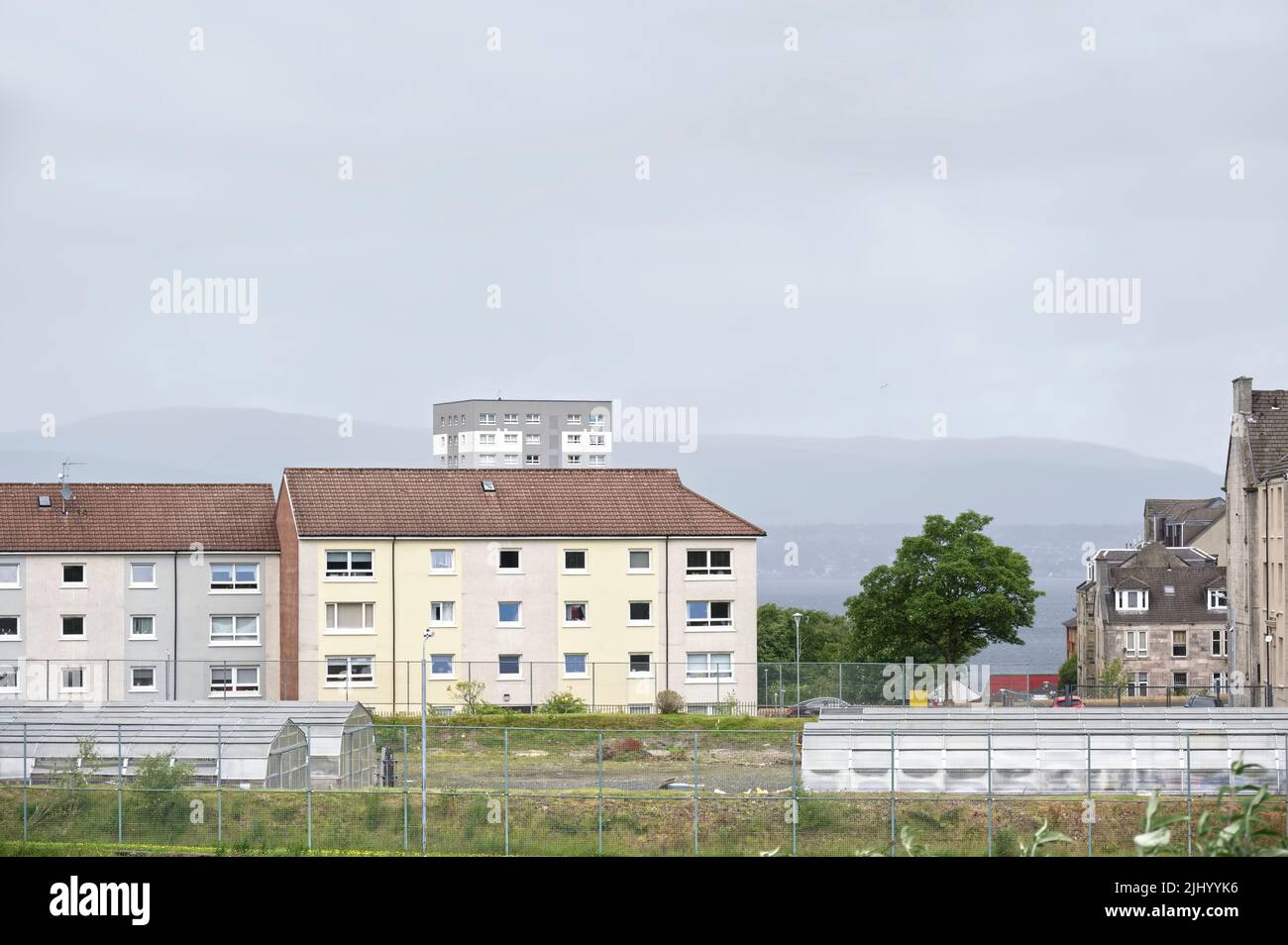 Derelict council house in poor housing estate slum with many social ...