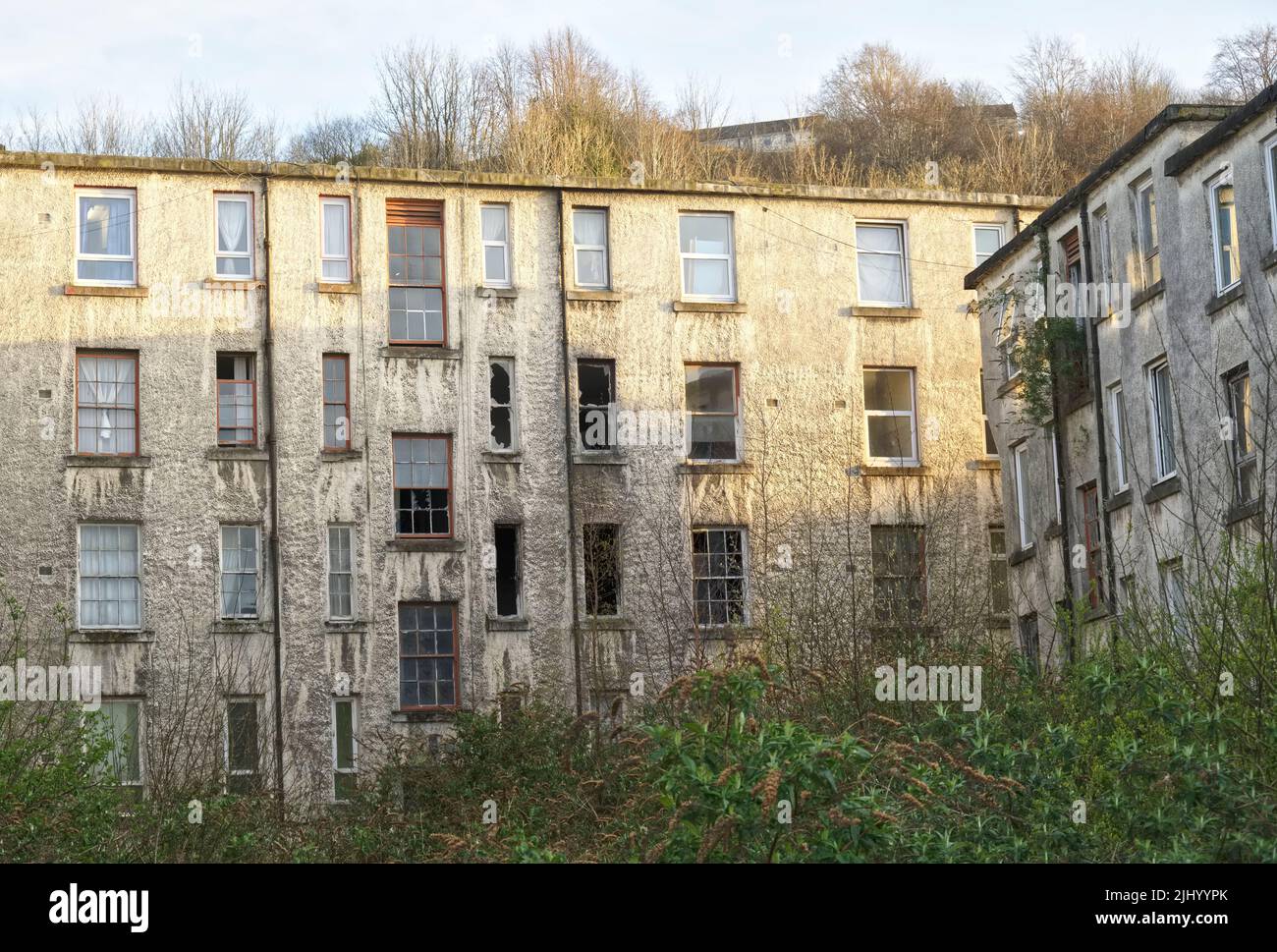 Derelict council house in poor housing estate slum with many social ...