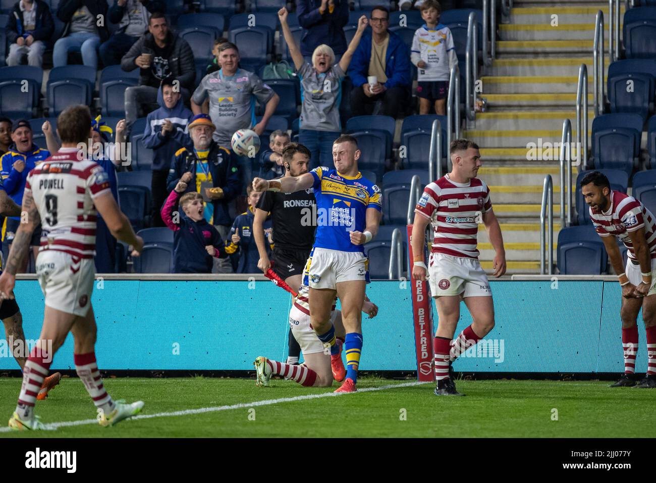 Harry Newman #3 of Leeds Rhinos celebrates his try and makes the score ...