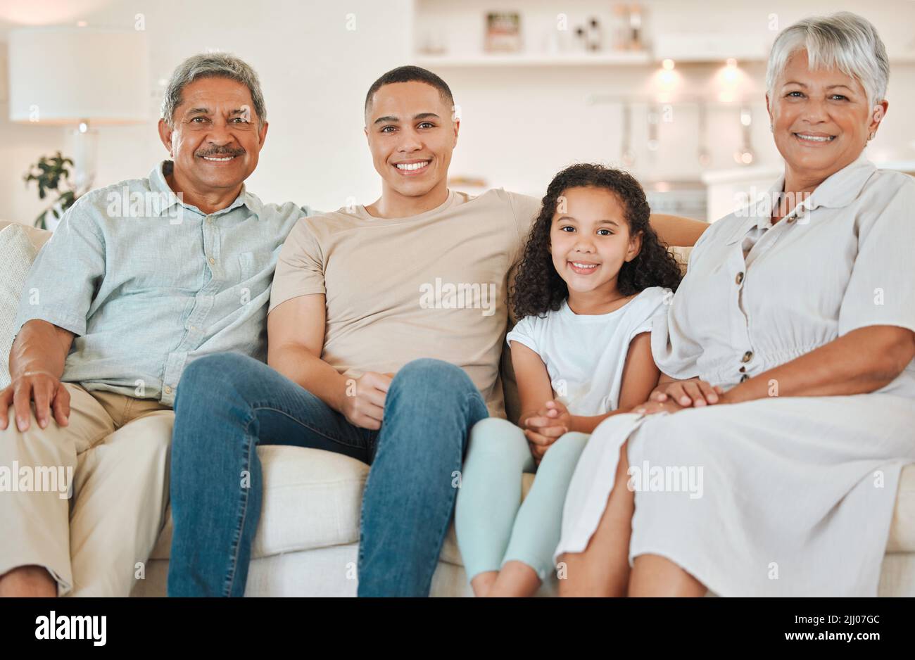 Typical Sundays. a beautiful family bonding on a sofa at home Stock ...