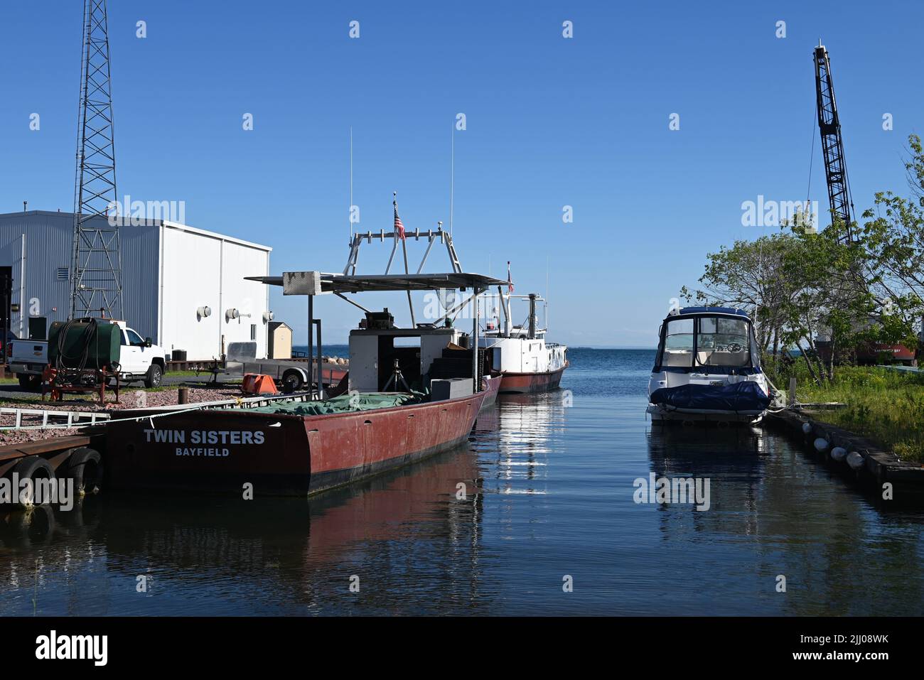 Commercial fishing boats are tied off at the dock in Bayfield, WI on ...