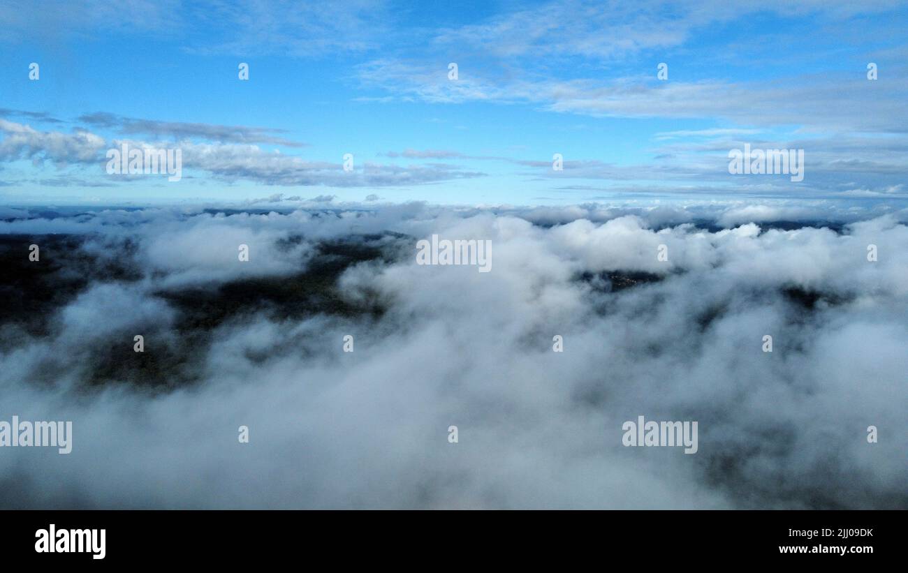 Turquoise clouds covering trees hi-res stock photography and images - Alamy
