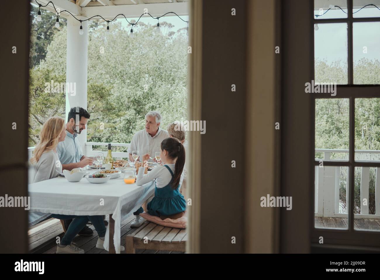 Sunday feast accomplishes more than just feeding us. a family having ...