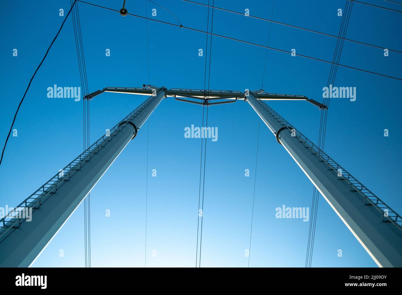 A modern hydro electric power distribution pole with cables against the ...