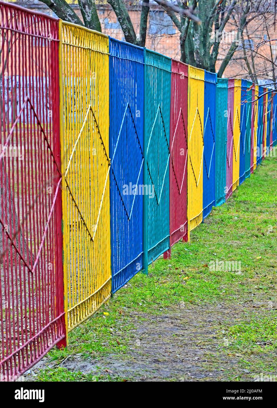 rainbow color long metal fence line, restricted zone diversity Stock ...