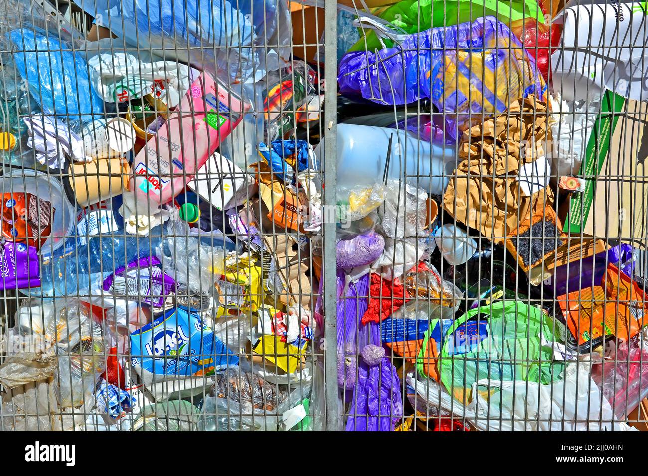 KIEV, UKRAINE - MAR 23: Household garbage heap in metallic grid ...