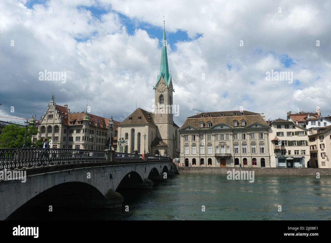The Fraumaunster Church with other iconic buildings, bridge, and Limmat ...