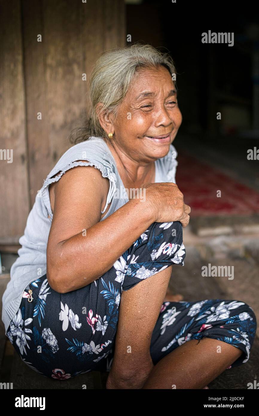 Chini, Malaysia: 19 April 2022 - A single indigenous woman sitting and ...