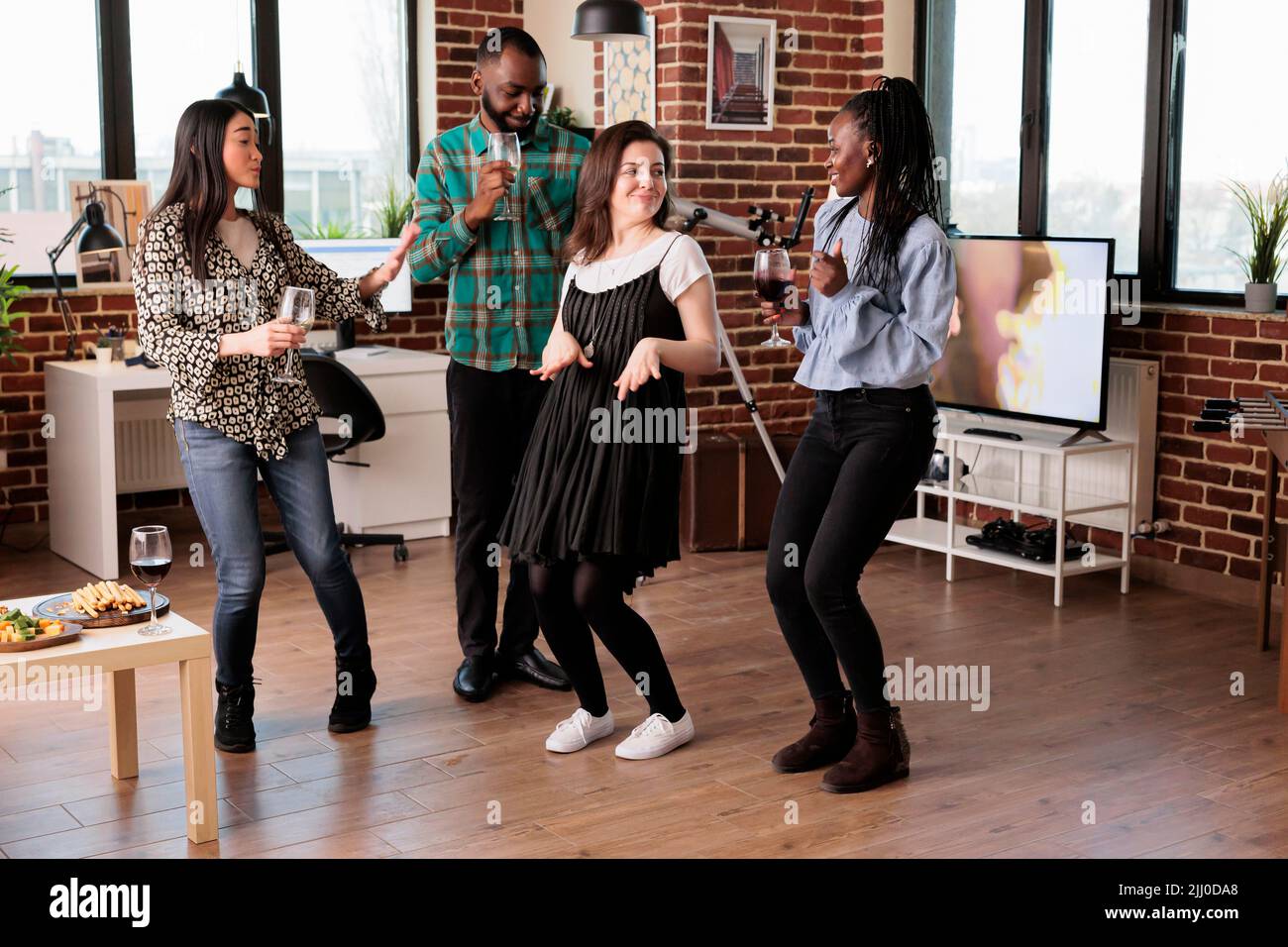 Multicultural family having fun eating hi-res stock photography and ...