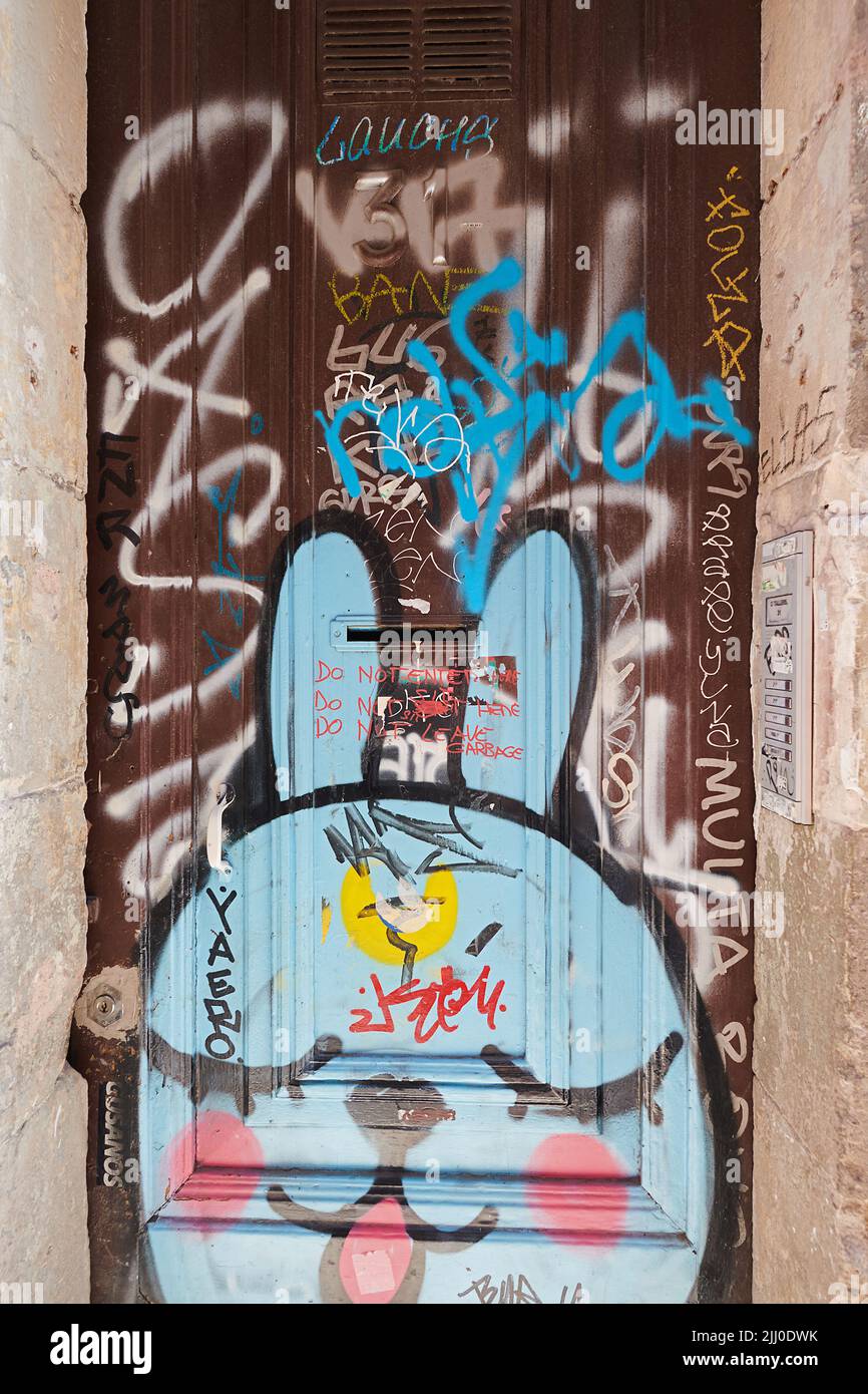 Old wooden door covered in graffiti Stock Photo - Alamy