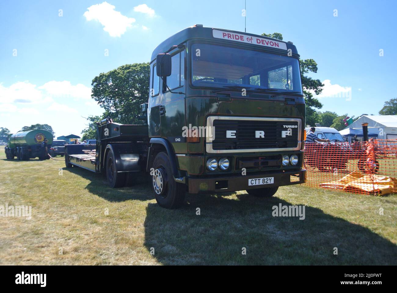 A 1982 ERF C40 lorry with low loader trailer parked on display at the ...
