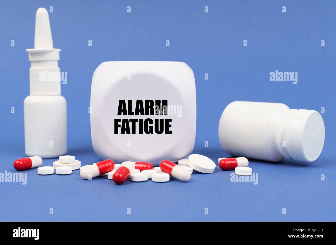 Medical concept. On the blue surface of the pill, capsule, spray, jar ...