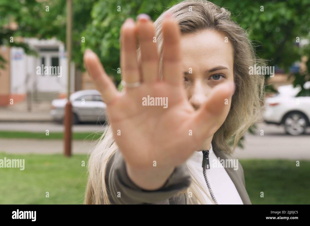 Young woman shows no gesture with hands. Emotions and gestures Stock ...