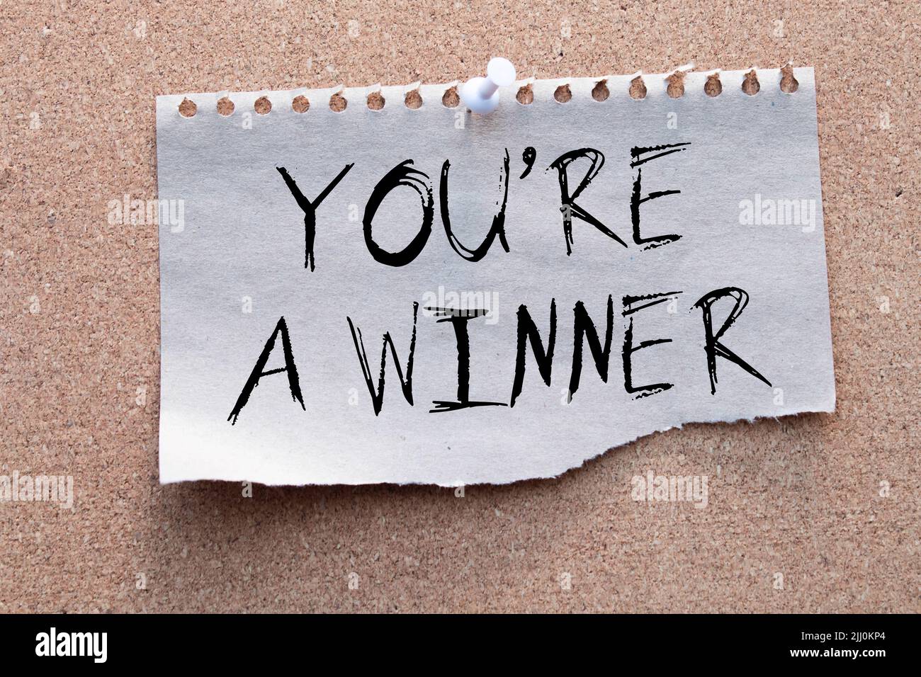 white paper with text You Re A Winner on a yellow background with ...