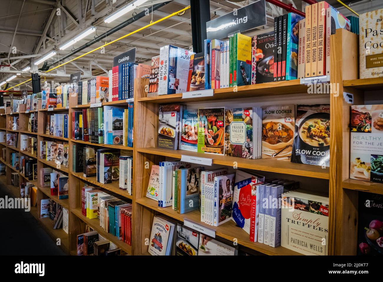 short bookshelves inside an unfurnished bookstore Stock Photo - Alamy