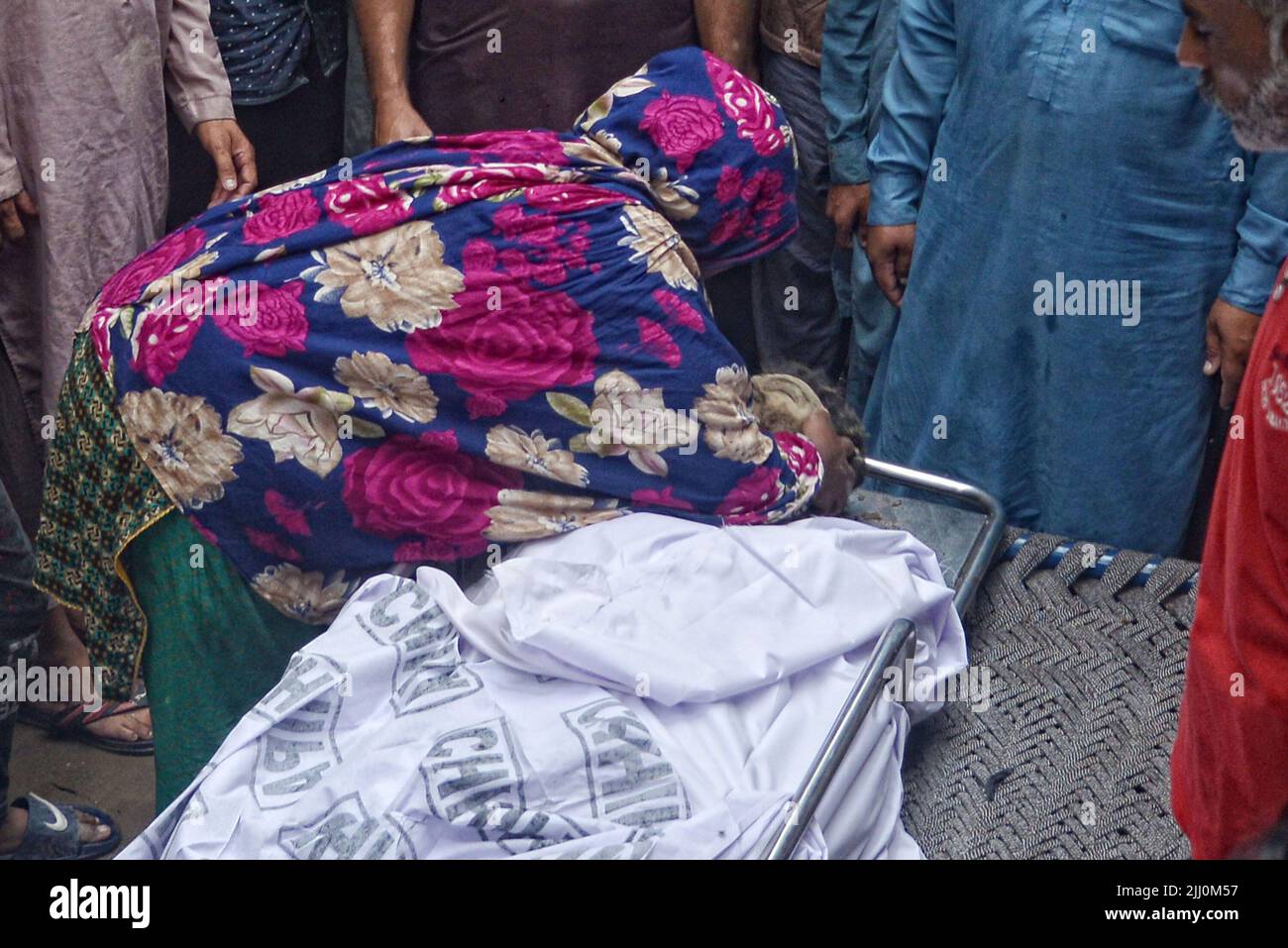 Lahore, Punjab, Pakistan. 21st July, 2022. Pakistani relatives carry ...