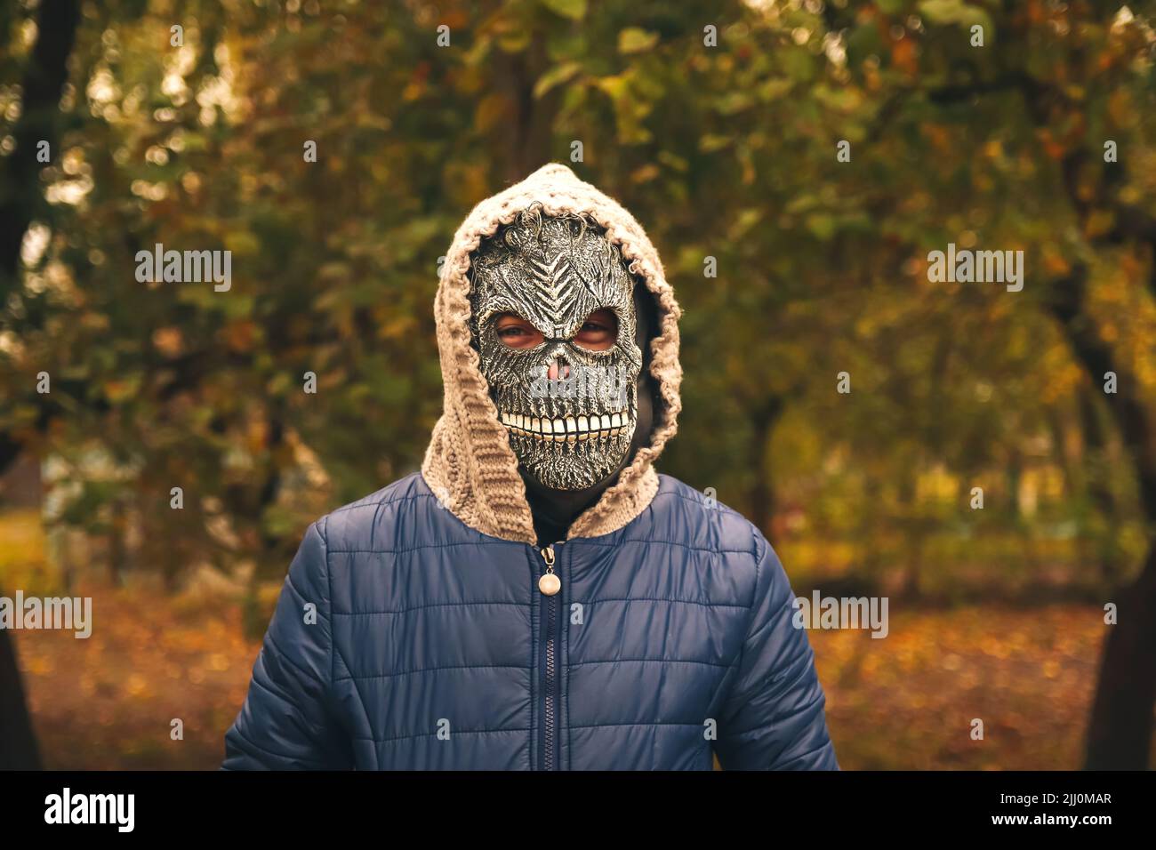 Defocus closeup Halloween people portrait. Person in grim reaper mask ...