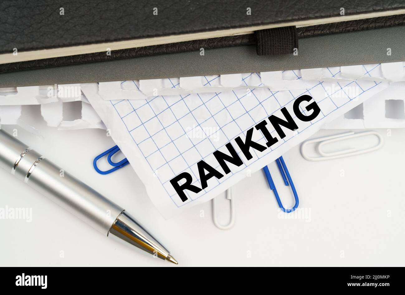 Business concept. On the table is a pen, notebooks and a crumpled sheet ...