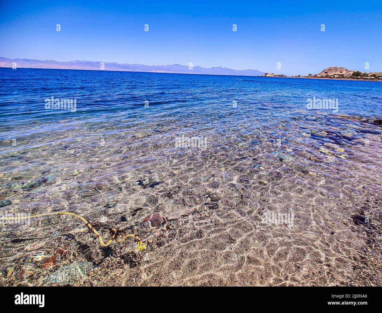 Rock and stones on the seashore on one of the beaches in Ras Shitan ...