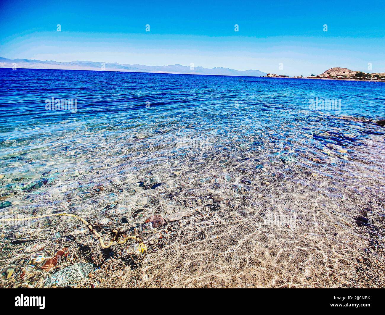 Rock and stones on the seashore on one of the beaches in Ras Shitan ...